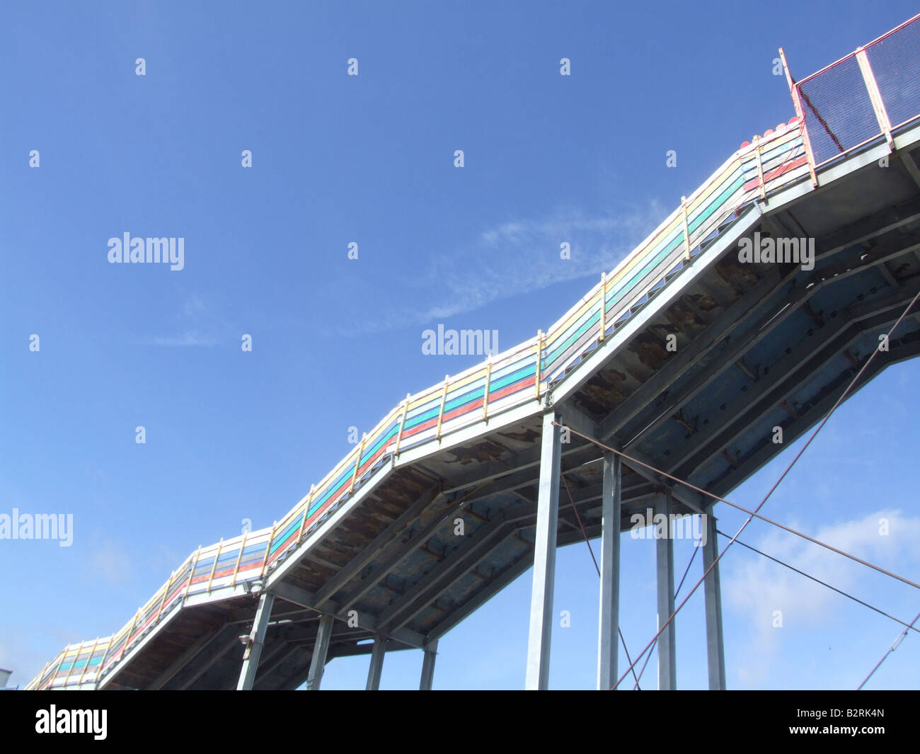 old colourful derelict big slide at fairground Stock Photo - Alamy
