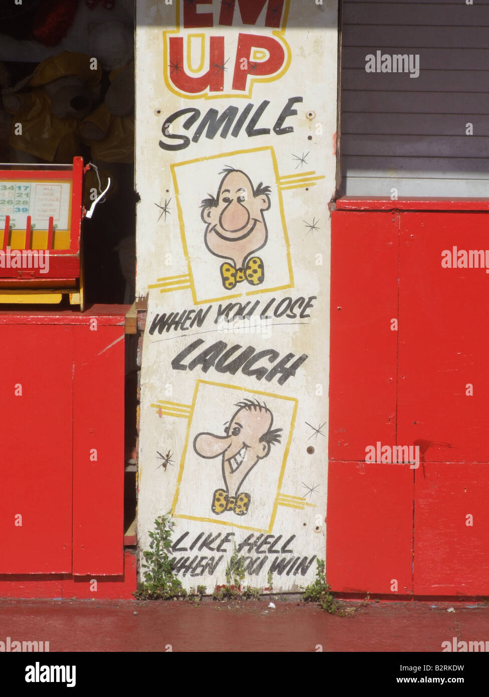 funny sign at old fair ground game stand stall Stock Photo - Alamy