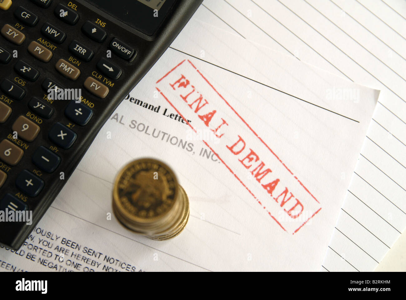 Doing the sums to pay a final demand bill final demand Stock Photo - Alamy