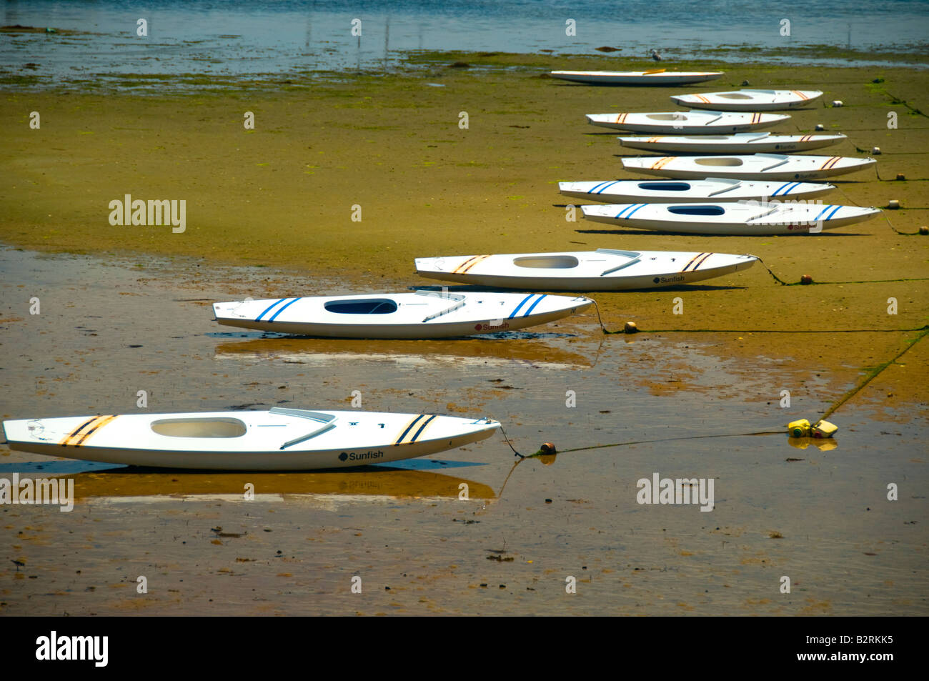Geometry of a line of sailboats at low tide Stock Photo - Alamy