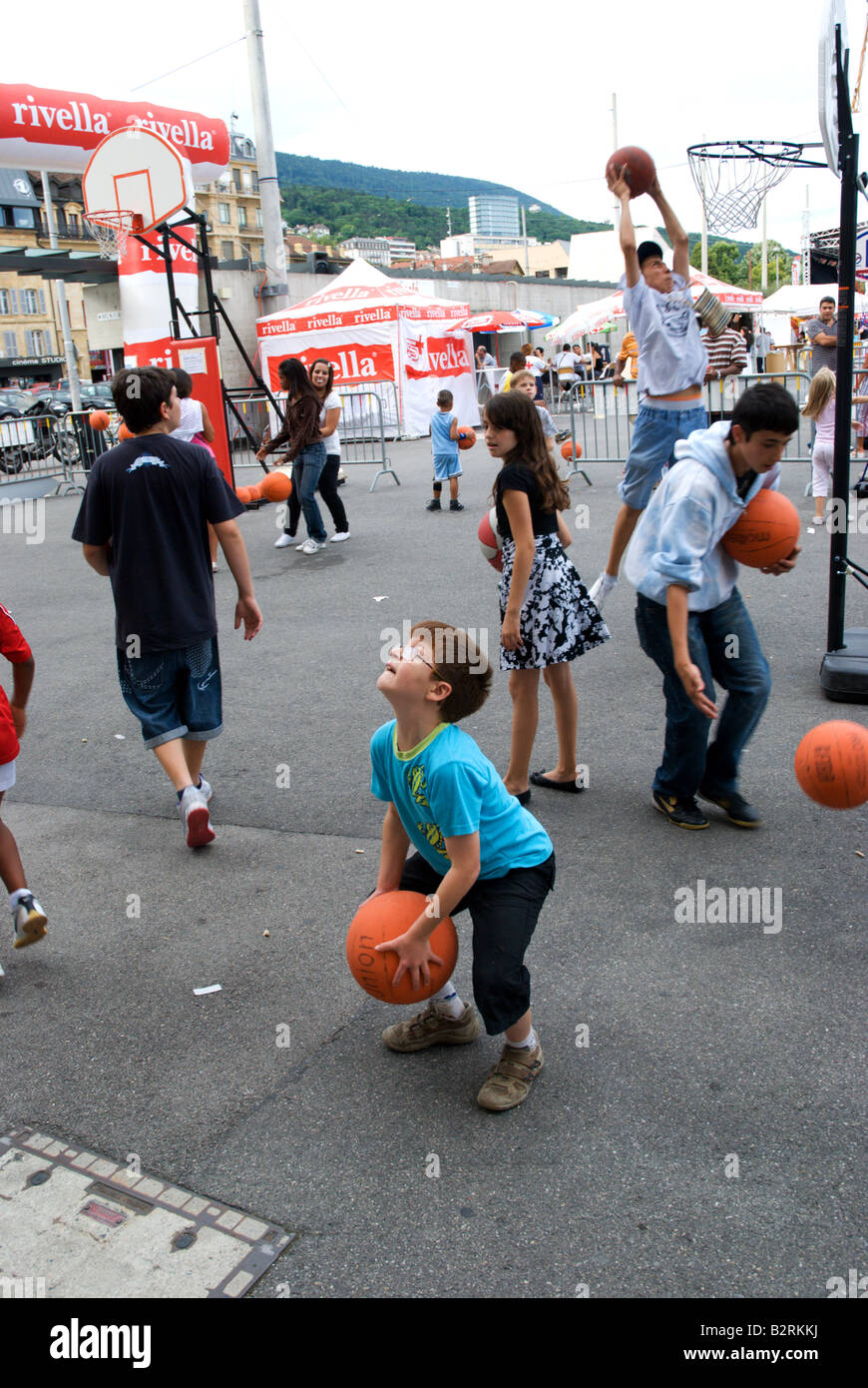 Young boy shooting baskets Stock Photo - Alamy