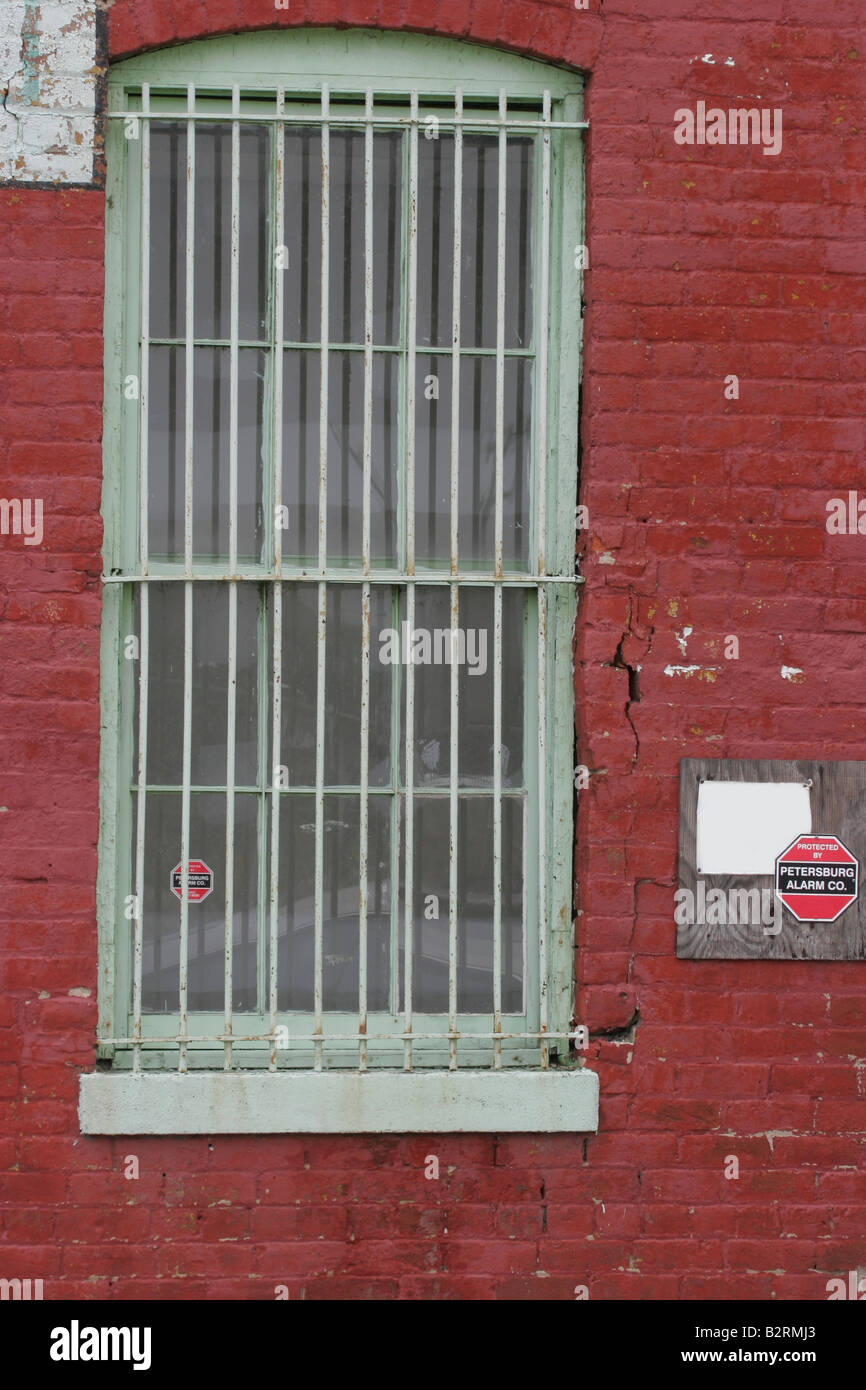 Barred window at food warehouse Stock Photo - Alamy