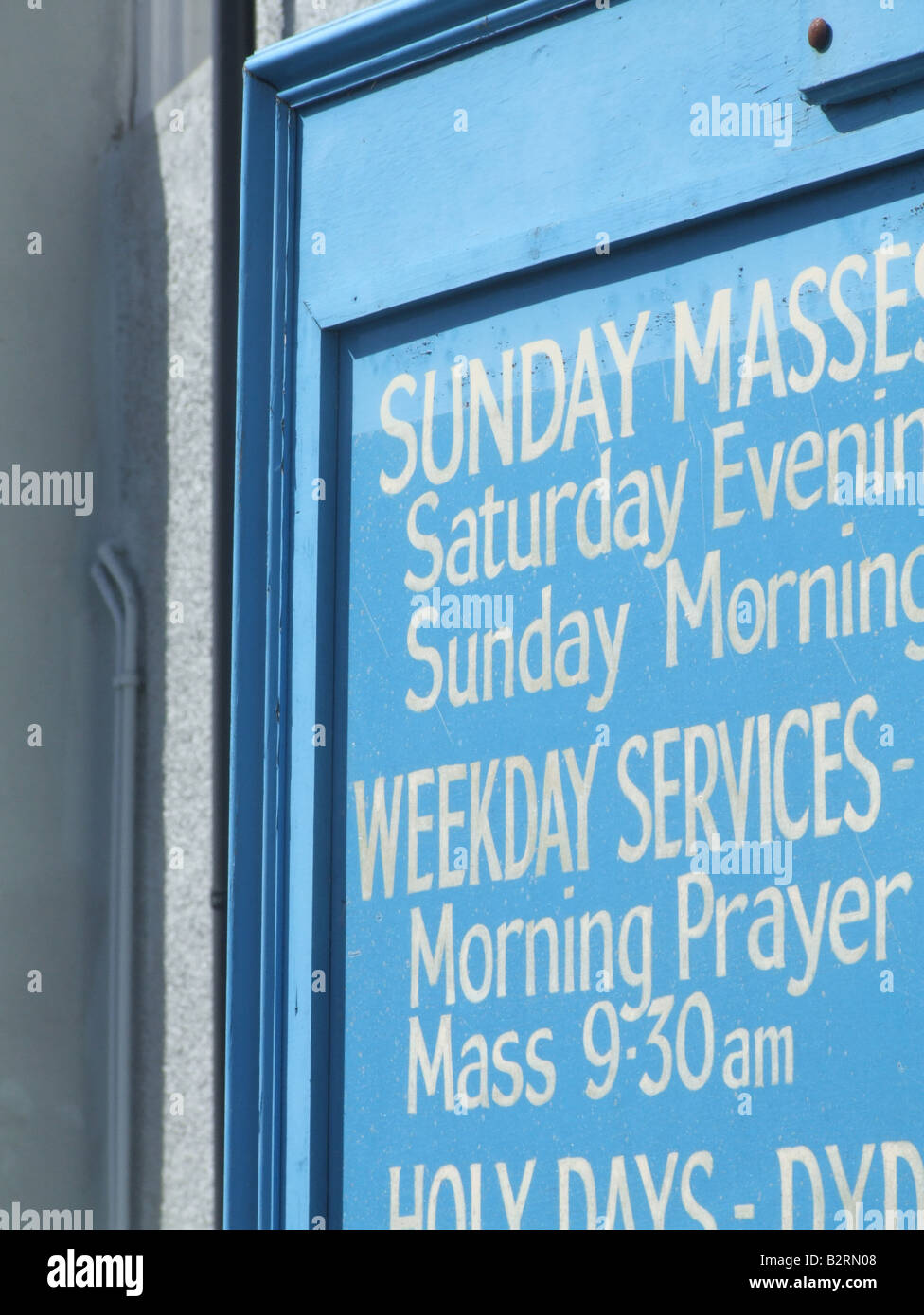 worship times notice outside church Stock Photo - Alamy