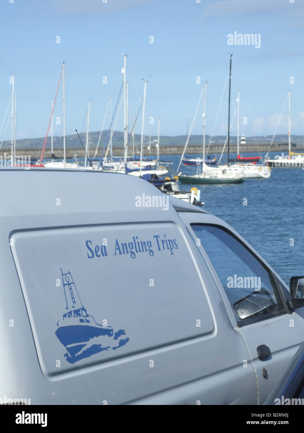 sea angling trips written on van in holyhead harbour, wales Stock Photo ...
