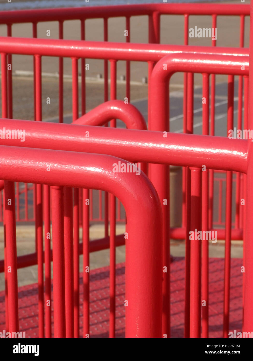 close up of red metal fence barrier in sun Stock Photo - Alamy