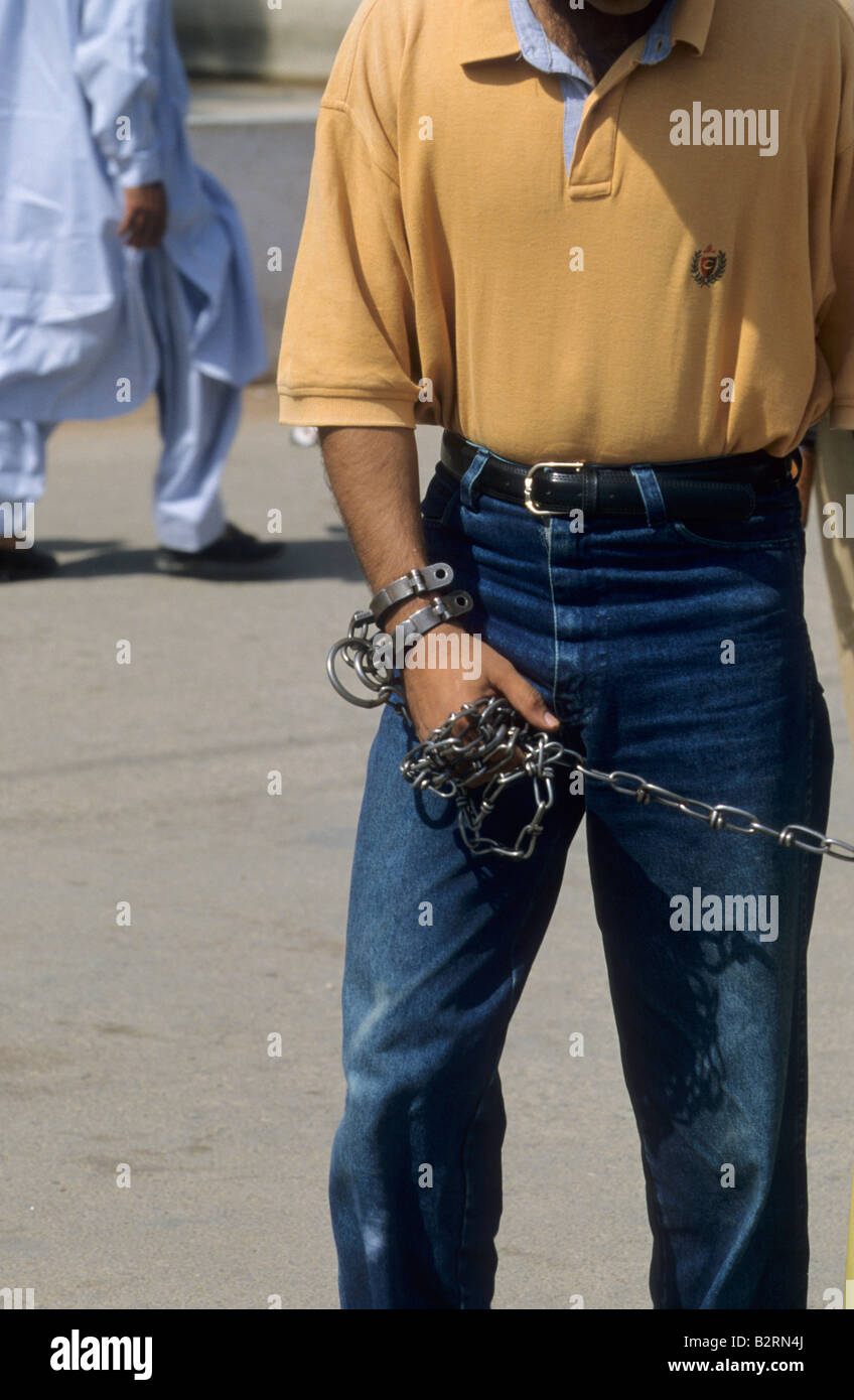 A Pakistani man under arrest is taken to a judge in Karachi Pakistan ...