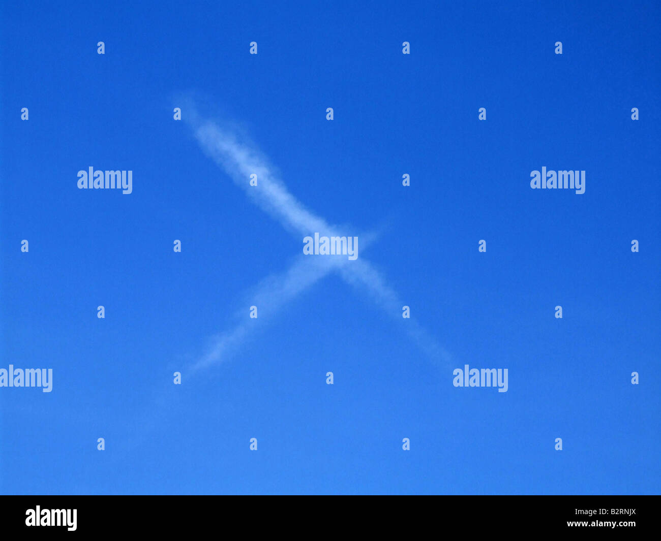 cross shaped clouds in blue sky in sun outdoors Stock Photo - Alamy