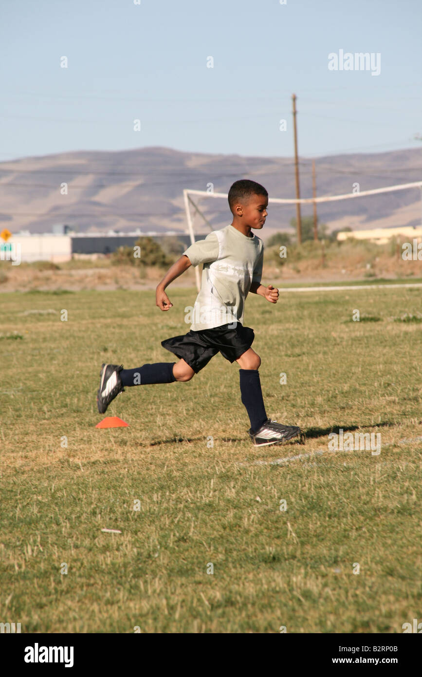 Bi-racial boy Running Stock Photo - Alamy