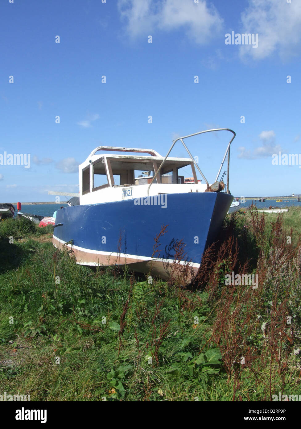 old boat left on dry land Stock Photo - Alamy