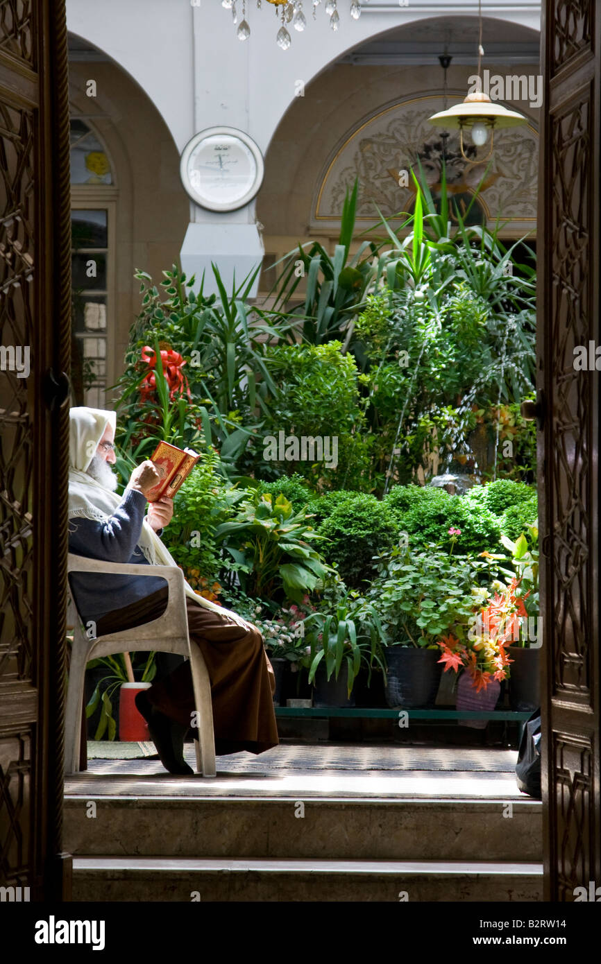 Muslim man reading quran in the mosque hi-res stock photography and ...