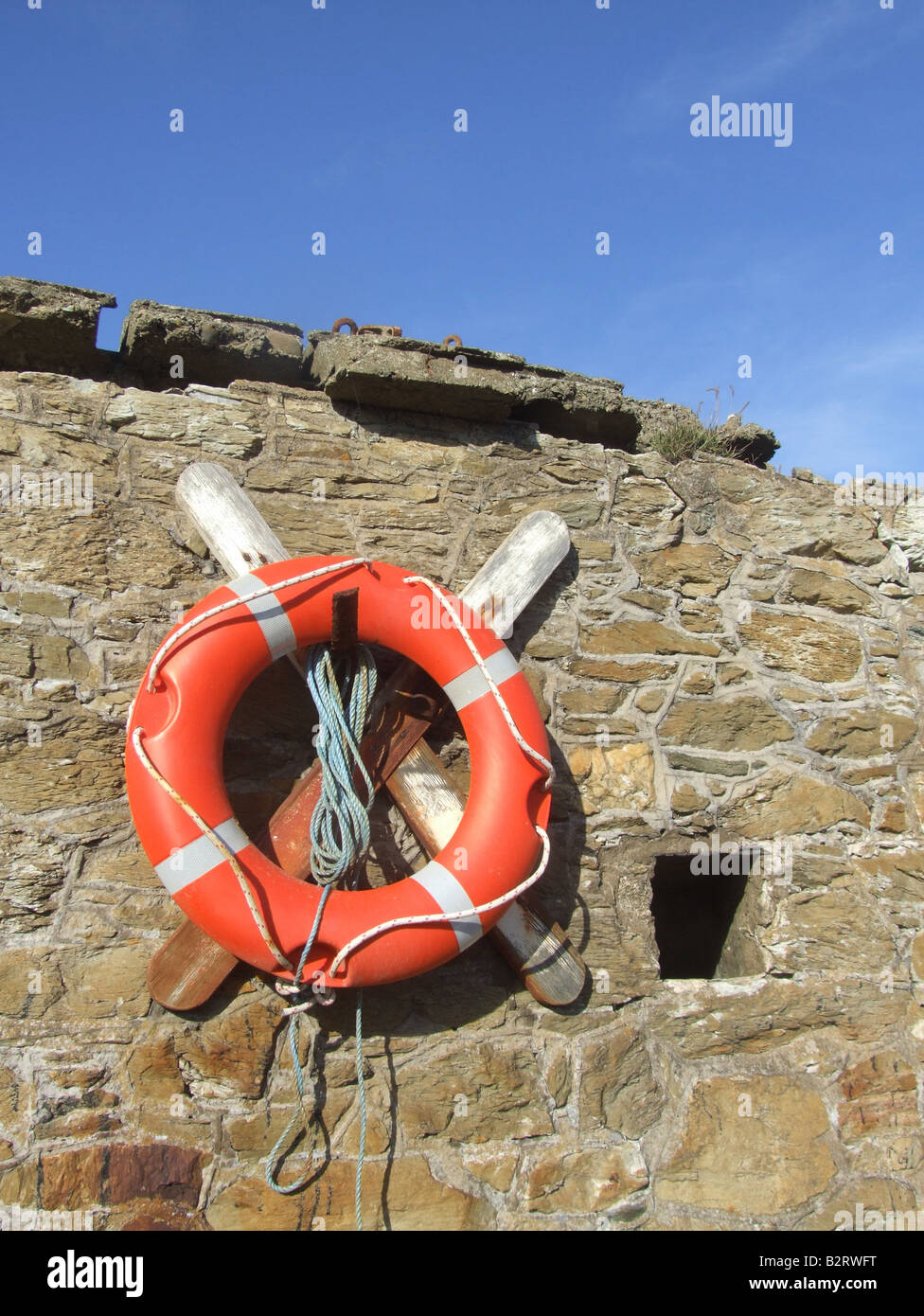 rubber ring at sos point in maritime port in uk Stock Photo - Alamy