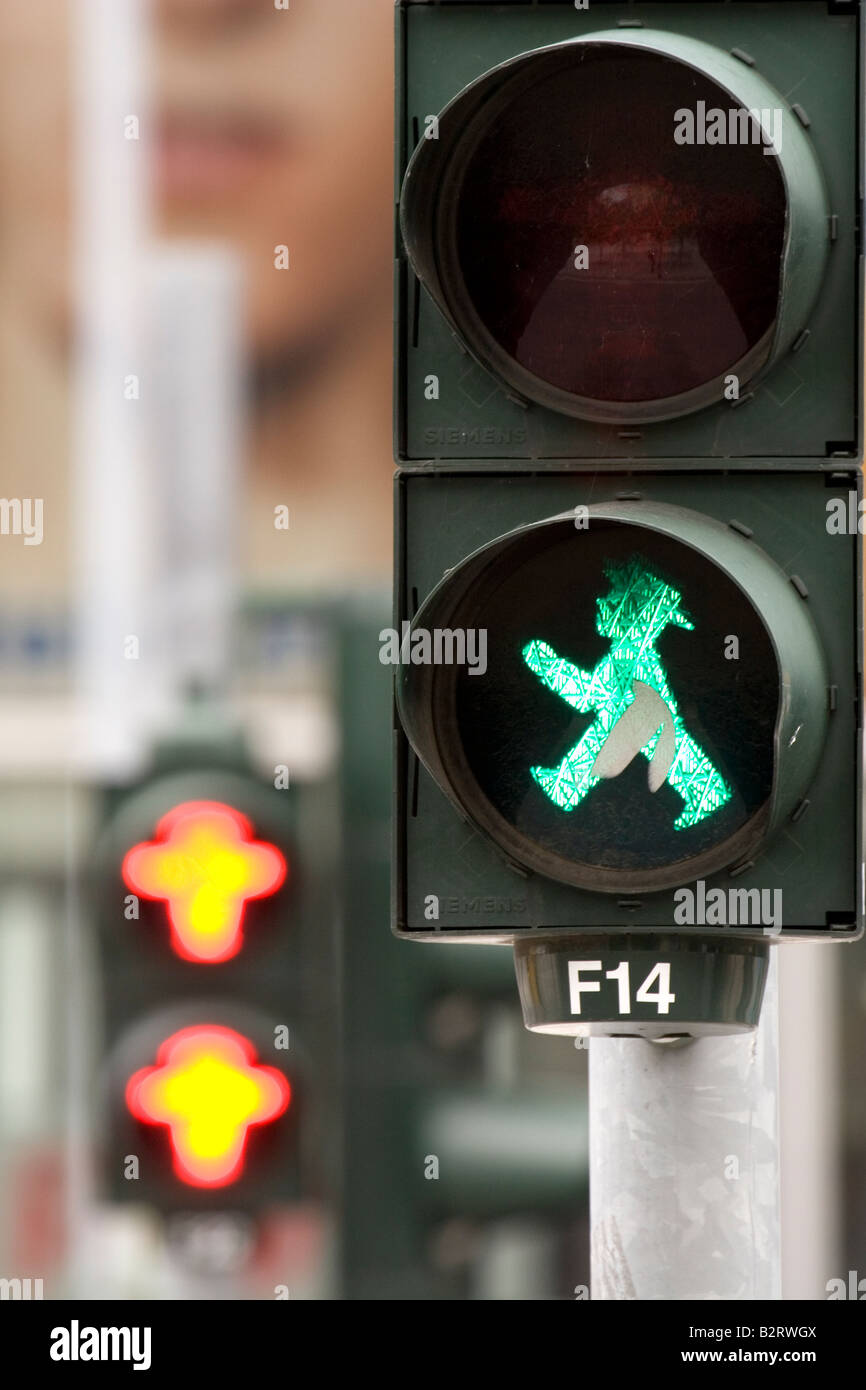 A green pedestrian traffic light in Dresden, Germany. The lights are ...