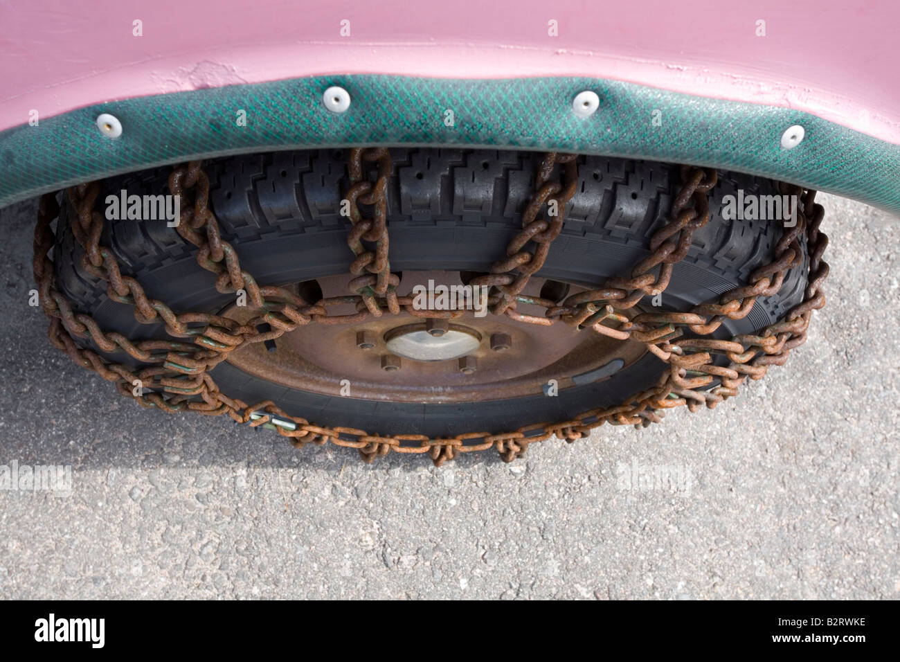 rusty snow chain on tyre Stock Photo - Alamy