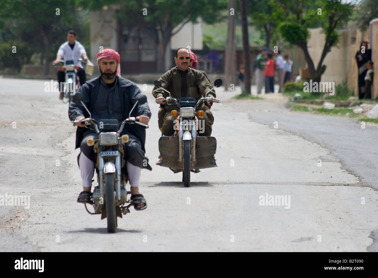 Muslim Men on Motorcycles in Apamea Syria Stock Photo - Alamy