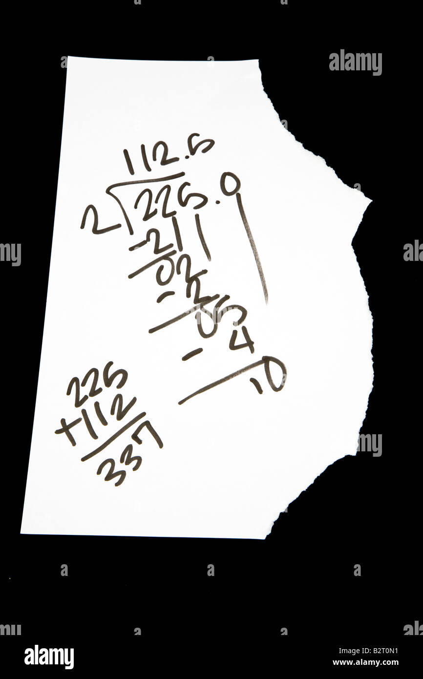 Long division maths problem sums on a black background Stock Photo - Alamy