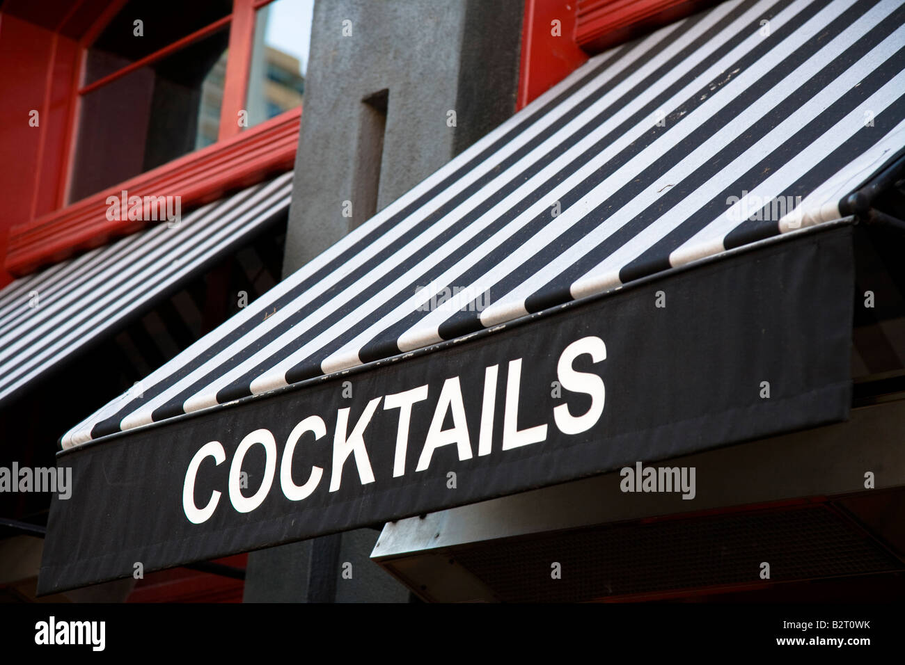 Cocktail display sign on striped black and white window canopy Gaslamp ...
