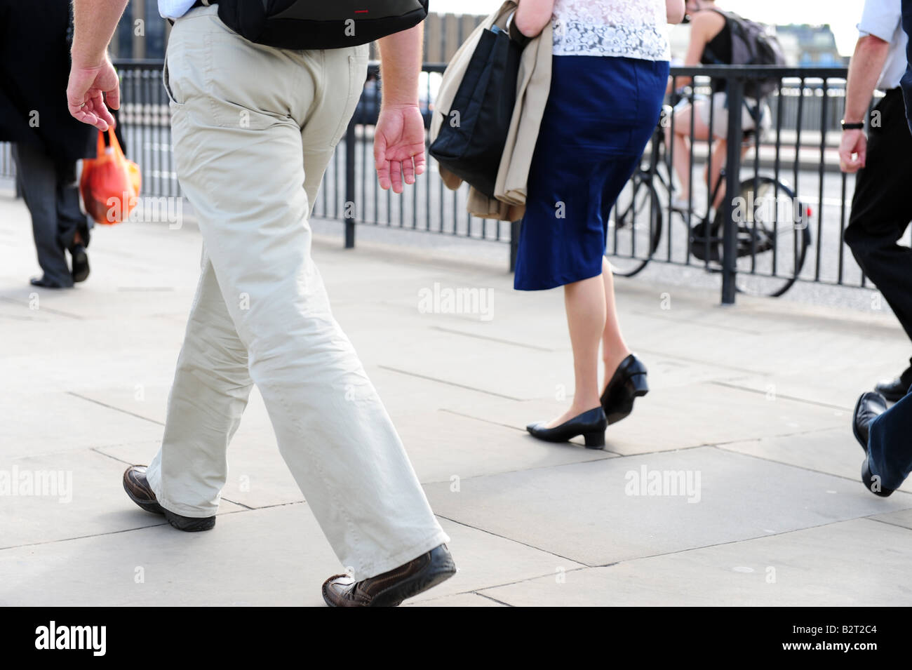 commuters walking over London bridge man woman workers london bridge ...