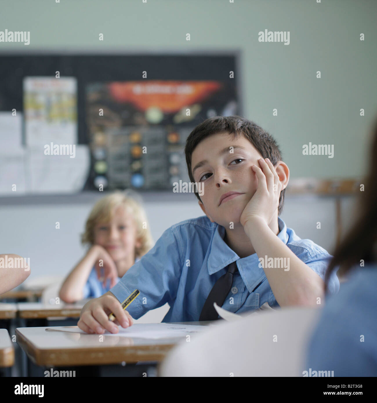 School boy listening in class Stock Photo - Alamy