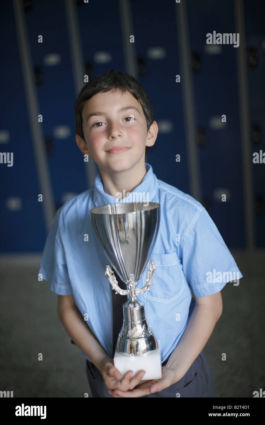 School boy holding trophy Stock Photo - Alamy