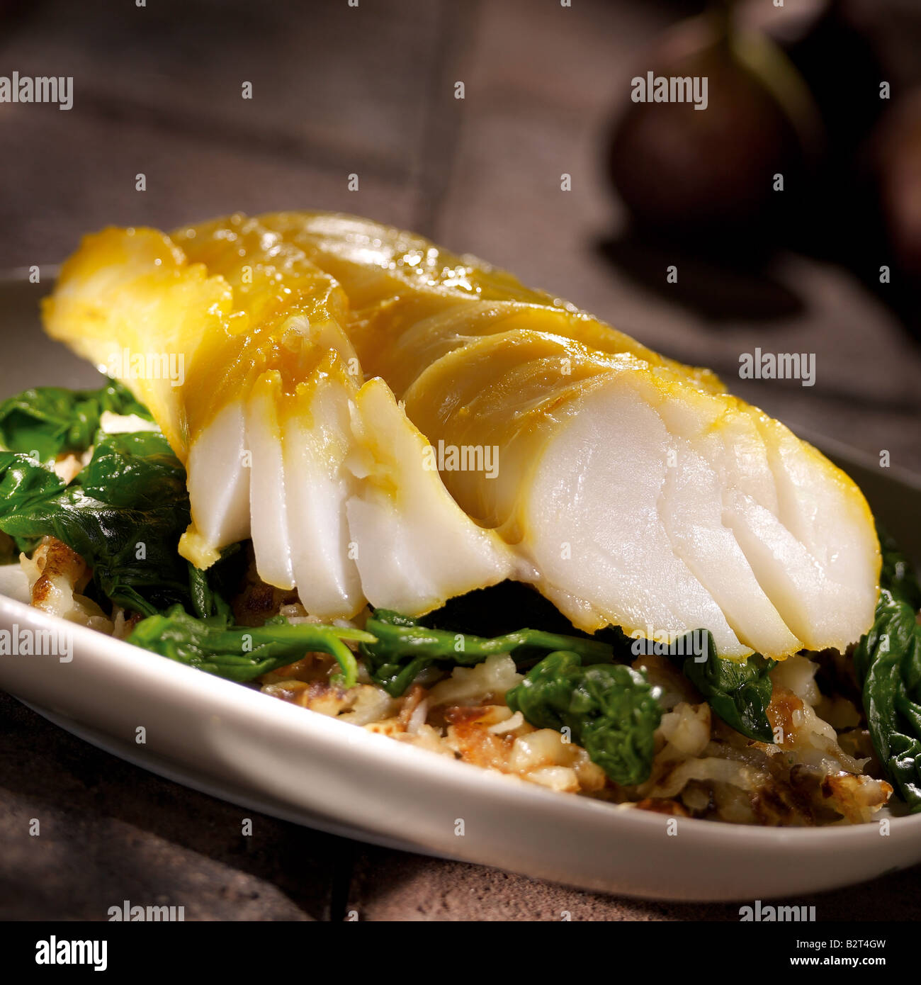 smoked cod on bed of green leaves Stock Photo - Alamy