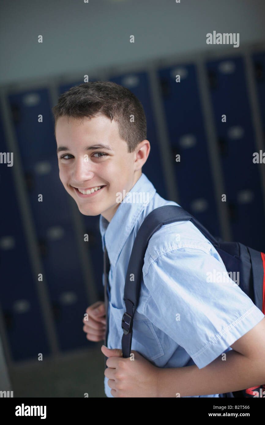 School boy holding backpack Stock Photo - Alamy