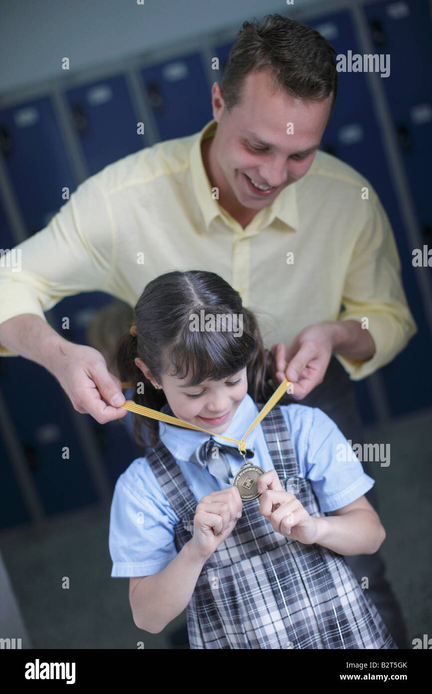 School girl being awarded medal Stock Photo - Alamy