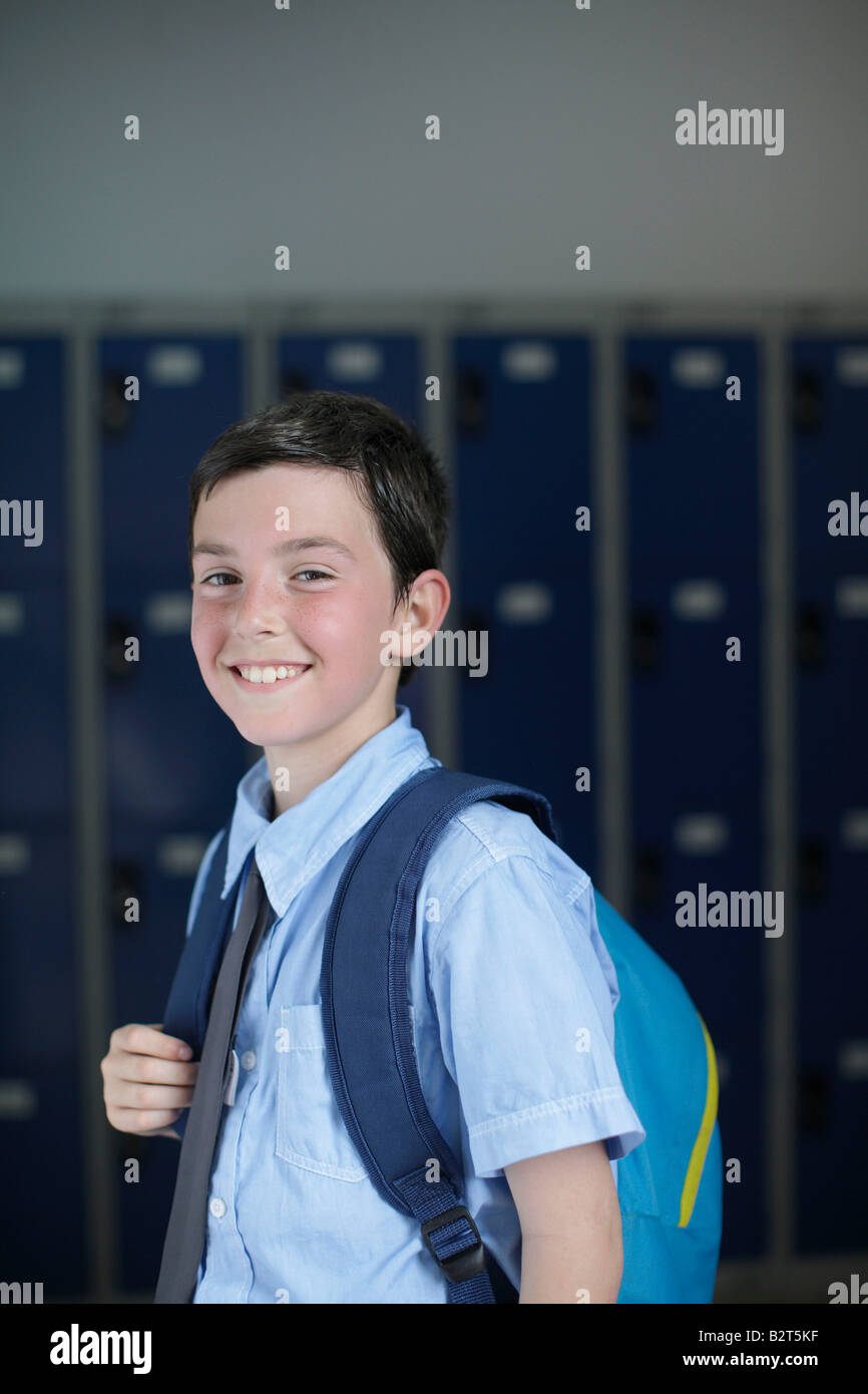 School boy holding backpack Stock Photo - Alamy