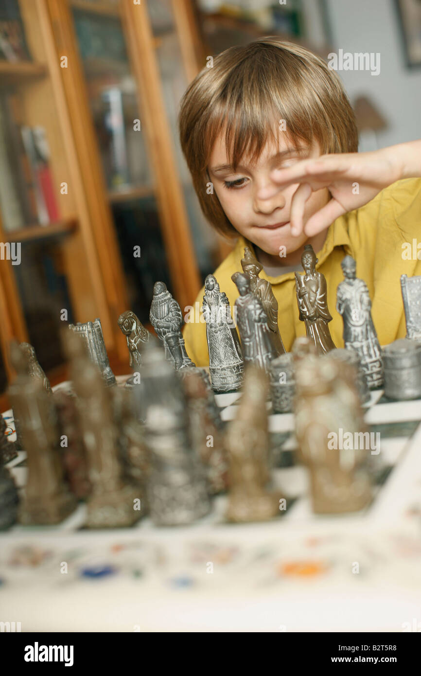 Young boy playing chess Stock Photo - Alamy