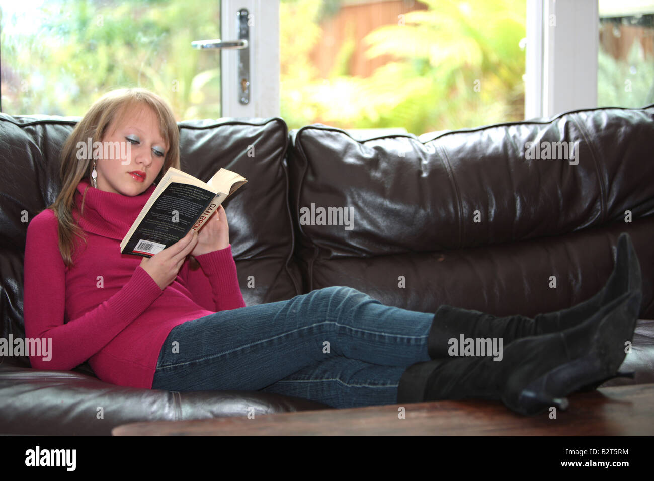 Teenage Girl Reading Book Model Released Stock Photo - Alamy
