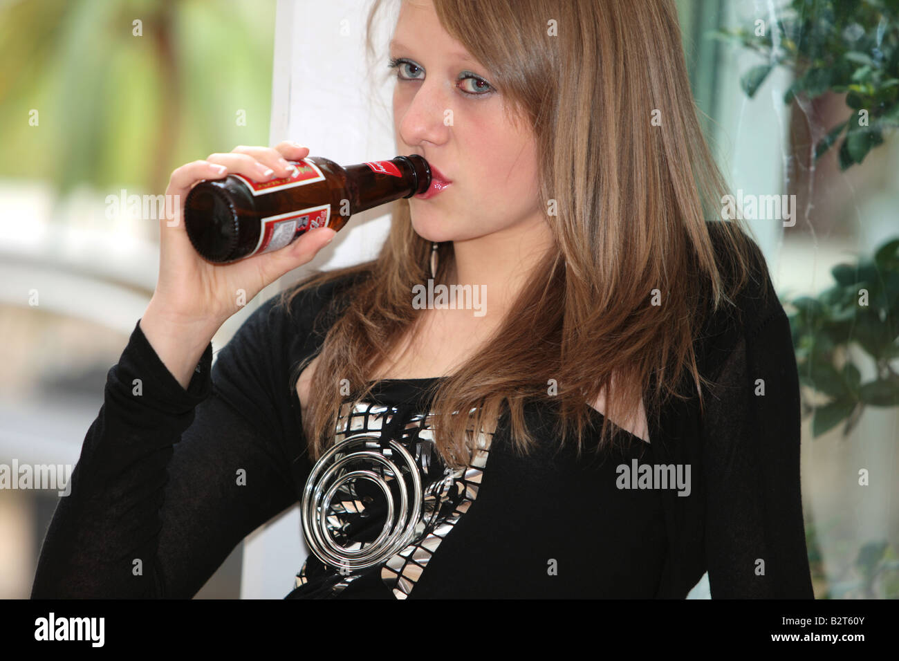 Teenage Girl Drinking Bottle of Beer Model Released Stock Photo - Alamy