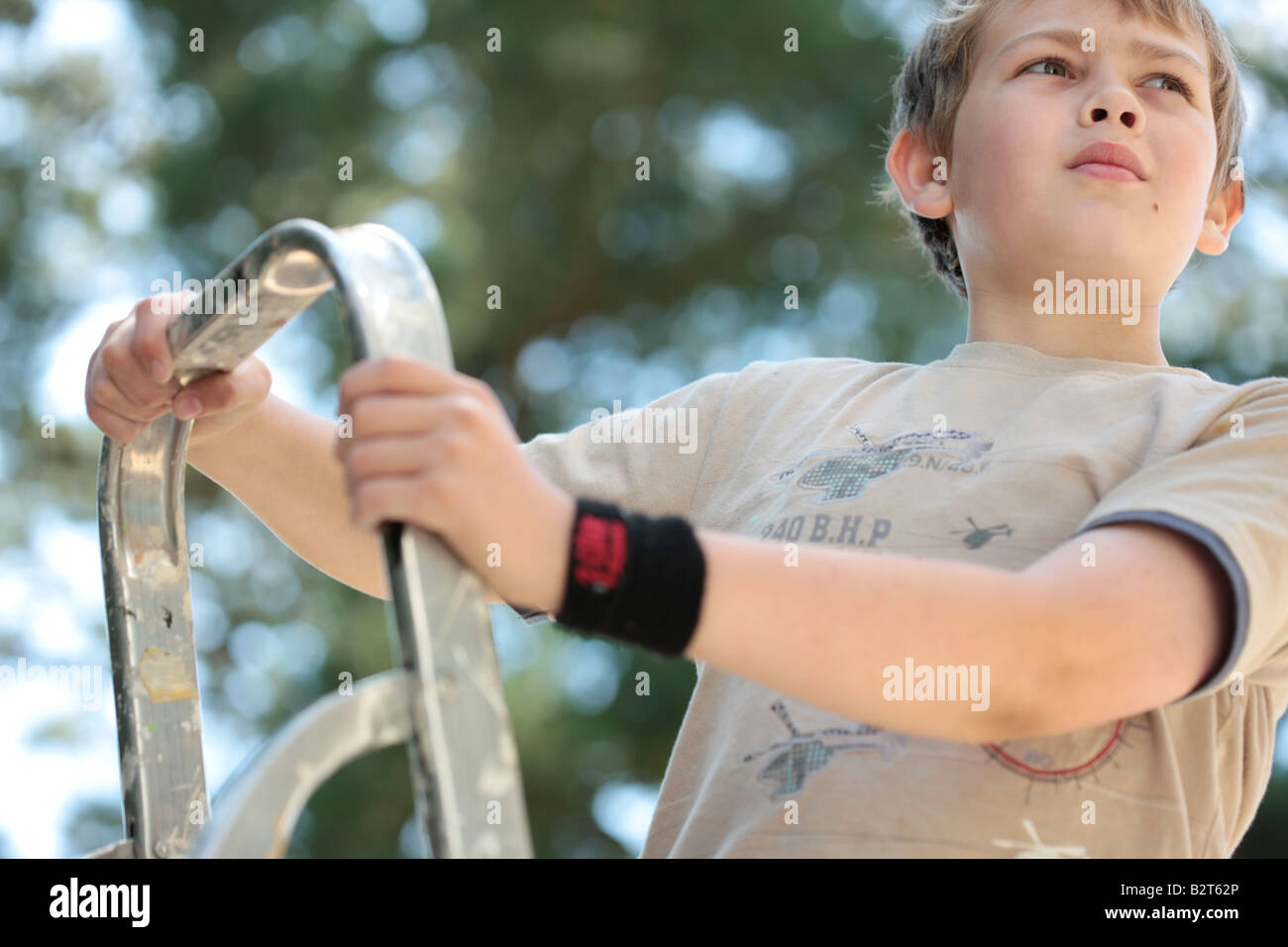 Young Boy Climbing Ladder Model Released Stock Photo - Alamy
