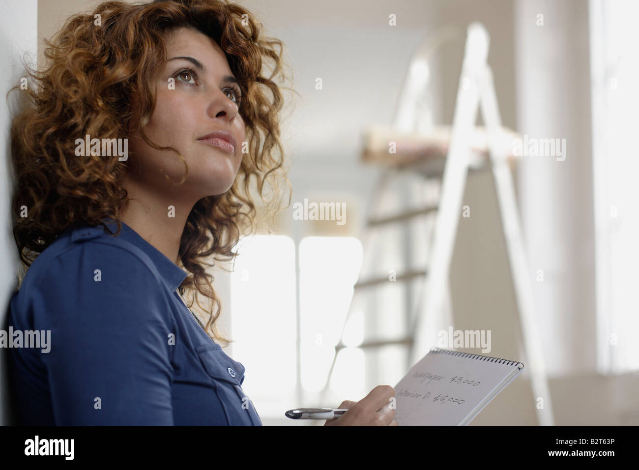 Woman writing notes Stock Photo - Alamy
