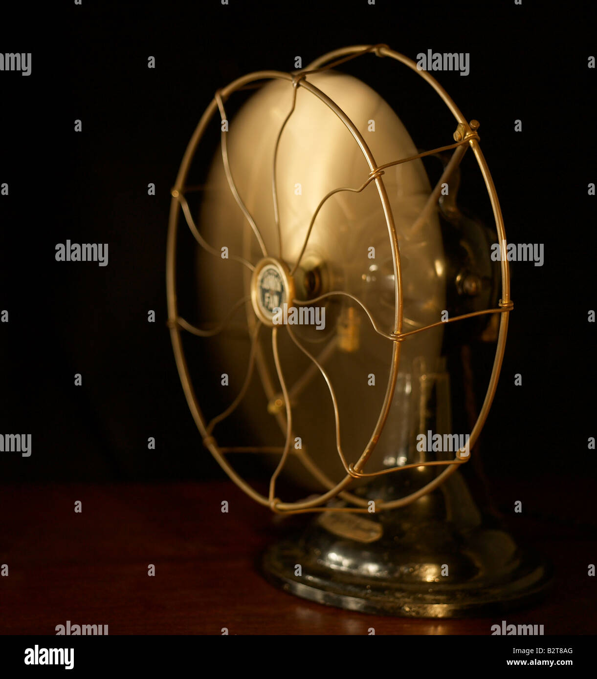 Antique style fan on dark wooden background fading to black Stock Photo ...