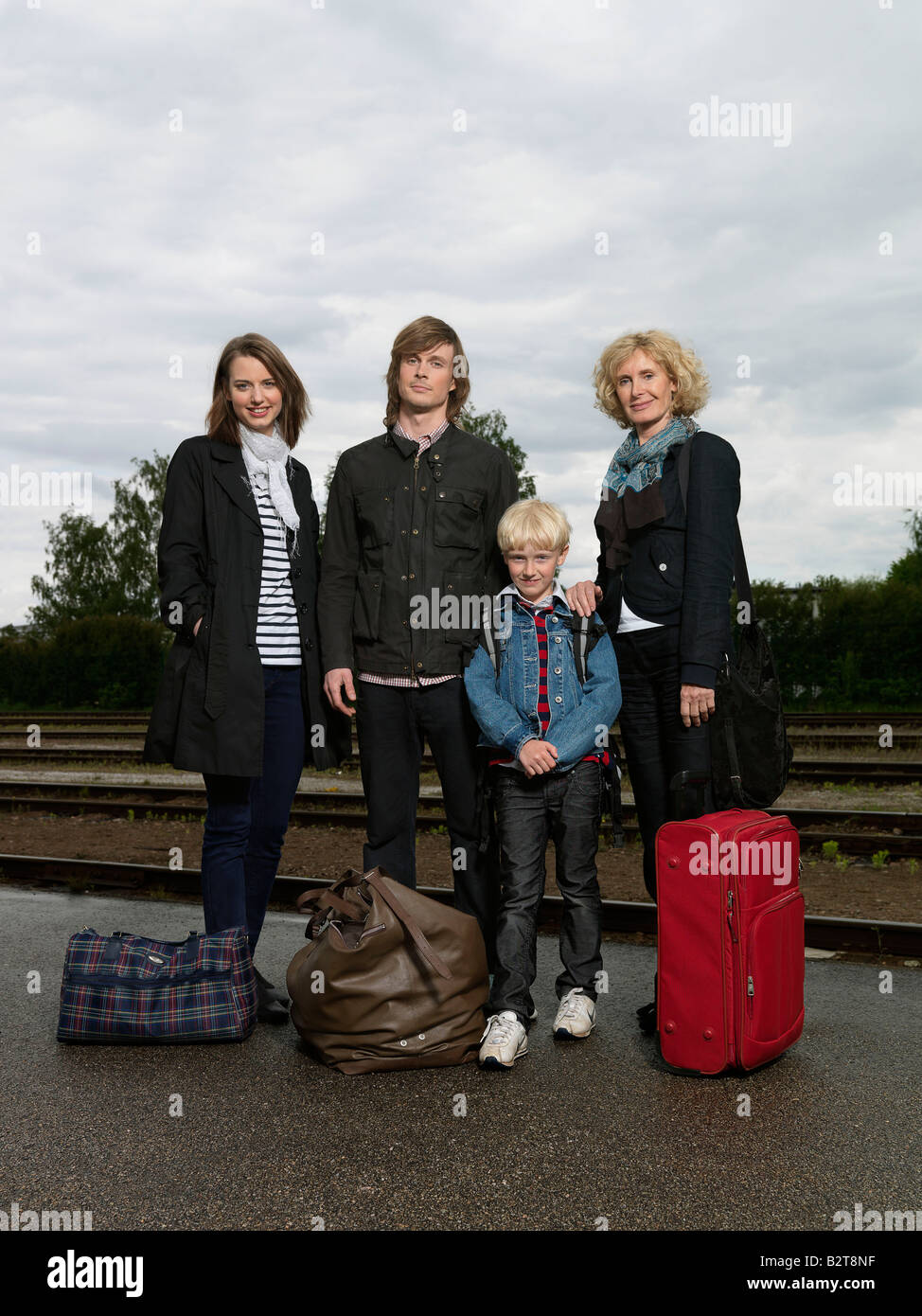 Family on train station Stock Photo - Alamy