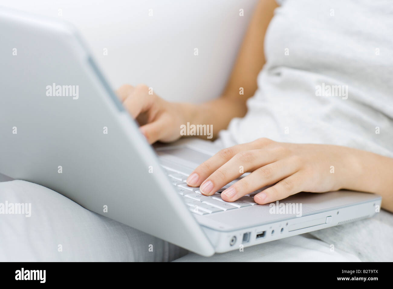 Female using laptop computer, cropped view Stock Photo - Alamy