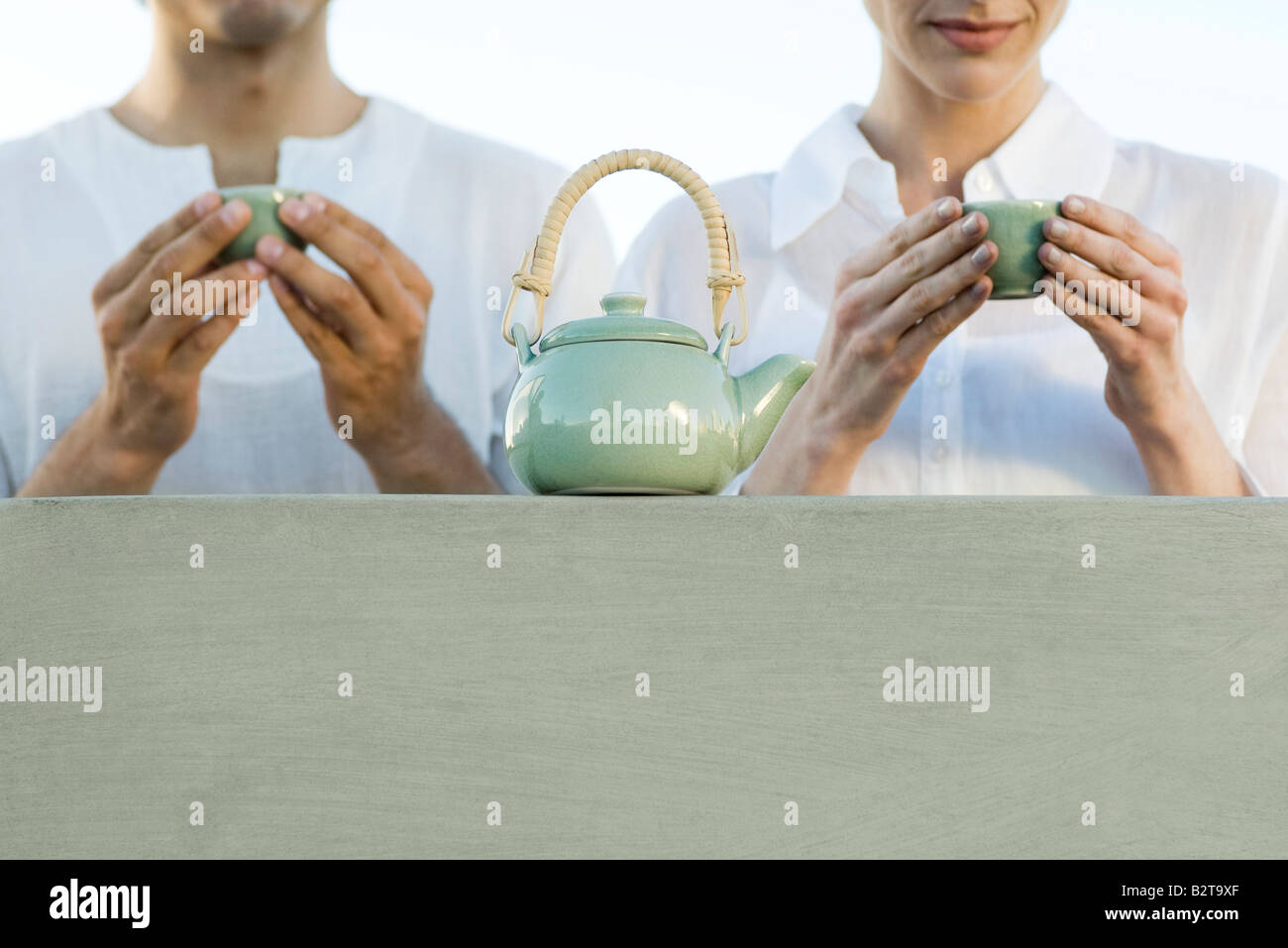 Man and woman having tea Stock Photo - Alamy
