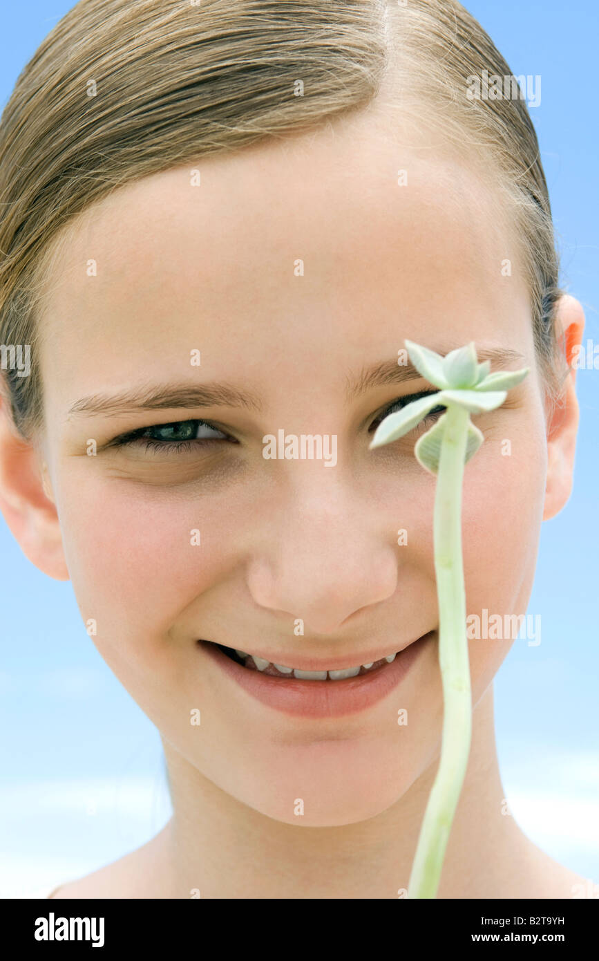 Girl with long stemmed succulent plant Stock Photo - Alamy