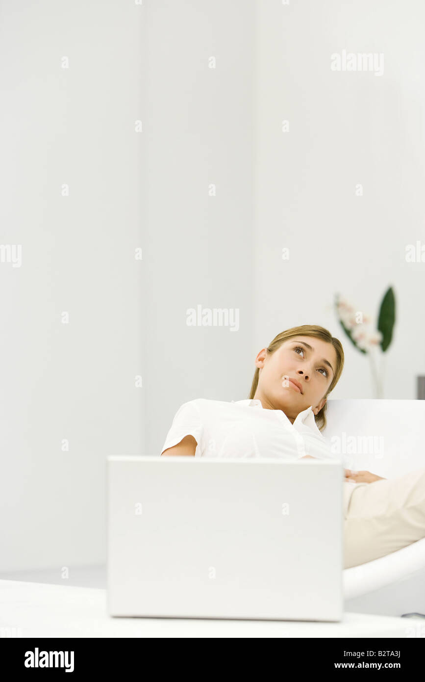 Leaning back in an arm chair hi-res stock photography and images - Alamy
