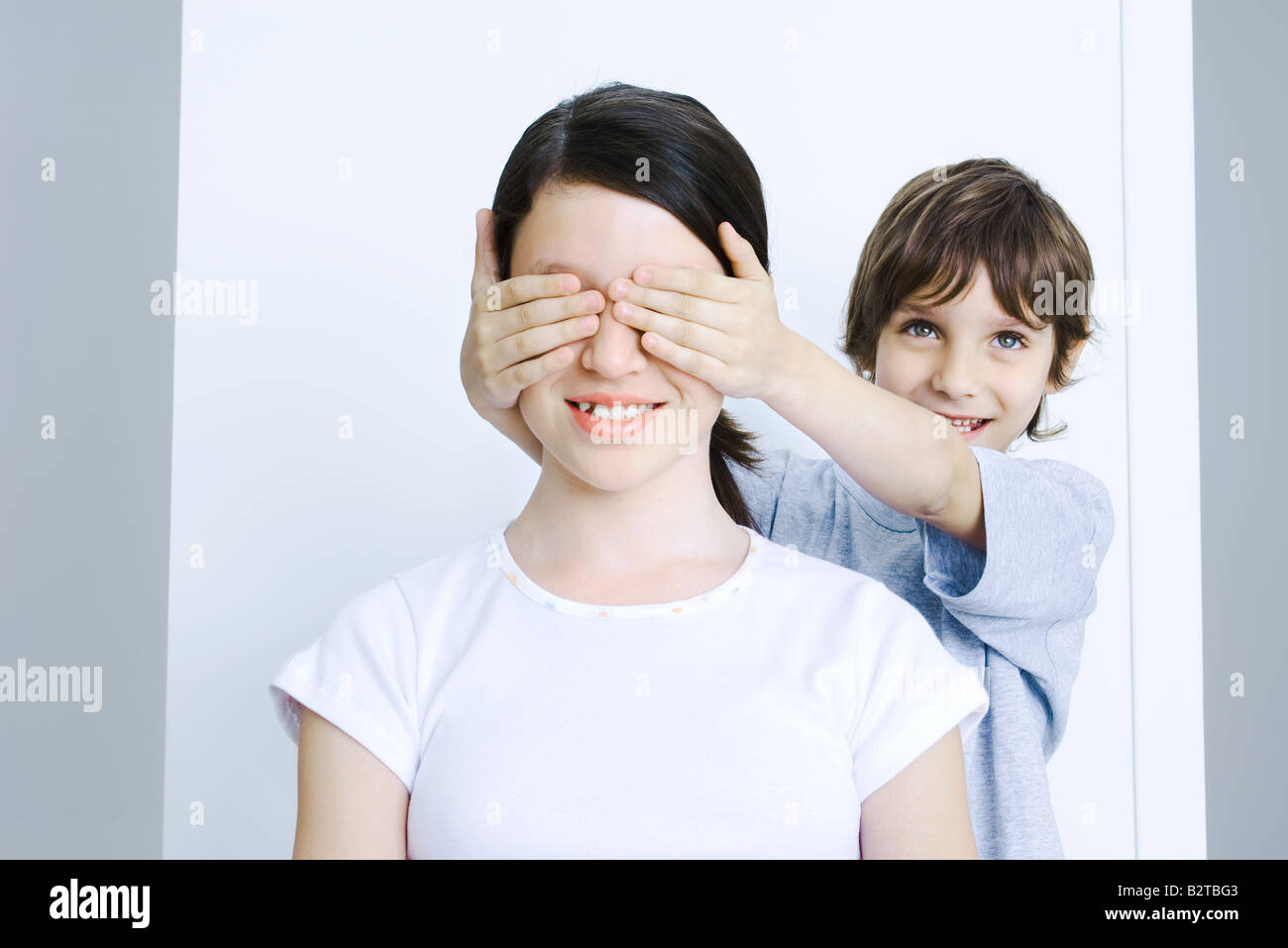 Preteen boy covering eyes hi-res stock photography and images - Alamy