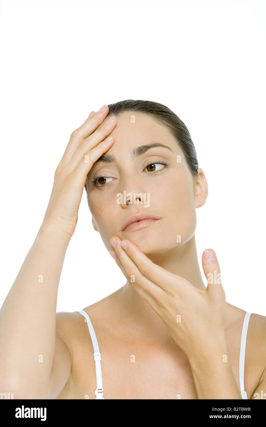 Woman touching face, portrait Stock Photo - Alamy
