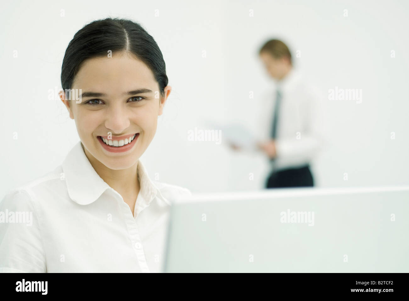 Female professional smiling at camera, portrait Stock Photo - Alamy