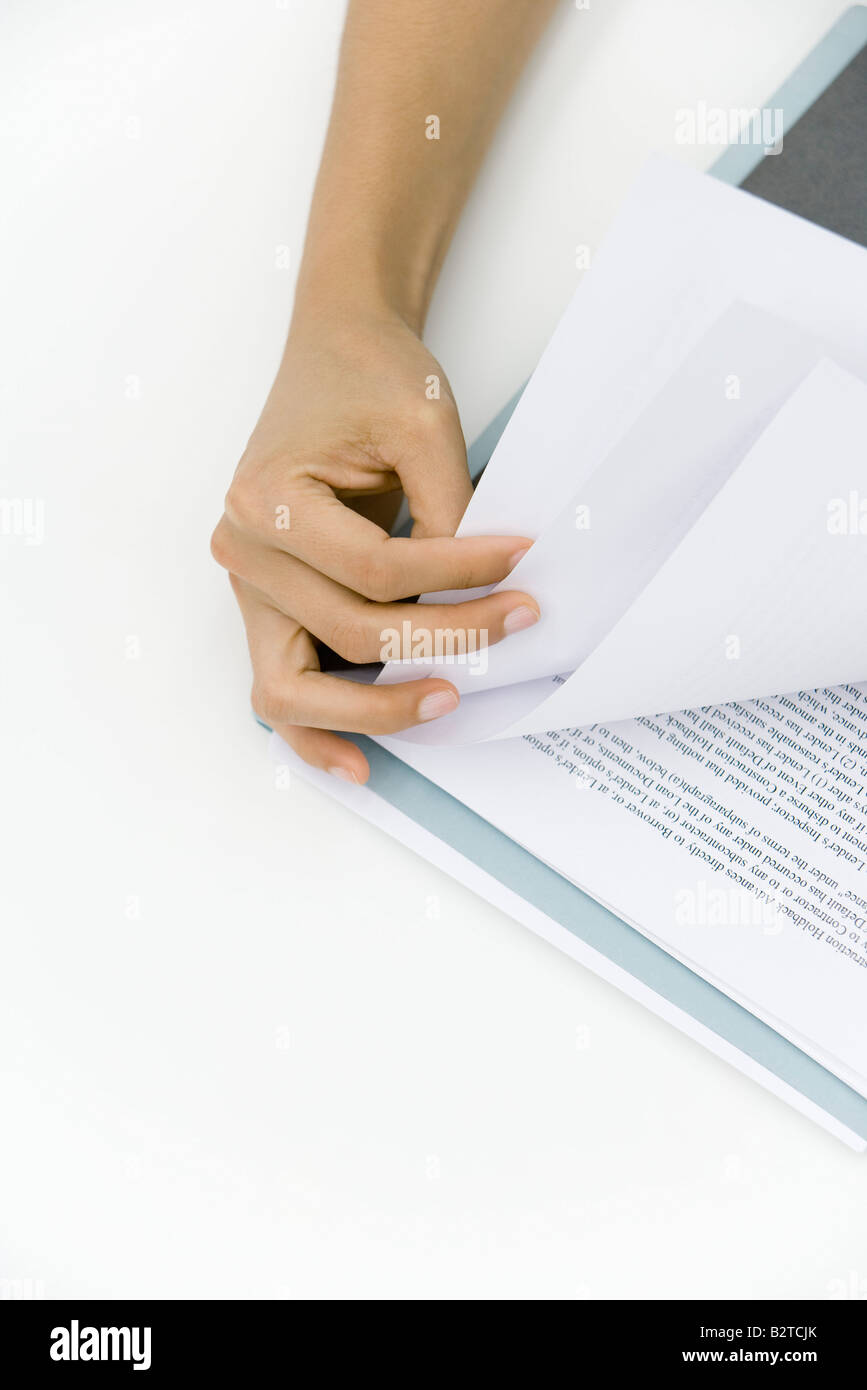 Hand turning document pages, close-up Stock Photo - Alamy