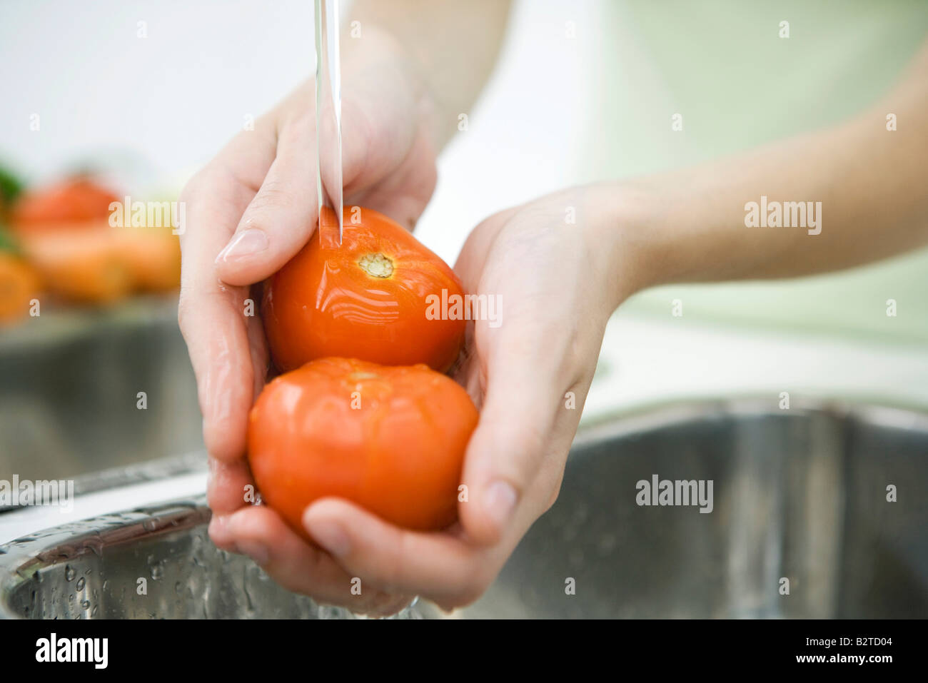 Washing tomato in running water hi-res stock photography and images - Alamy