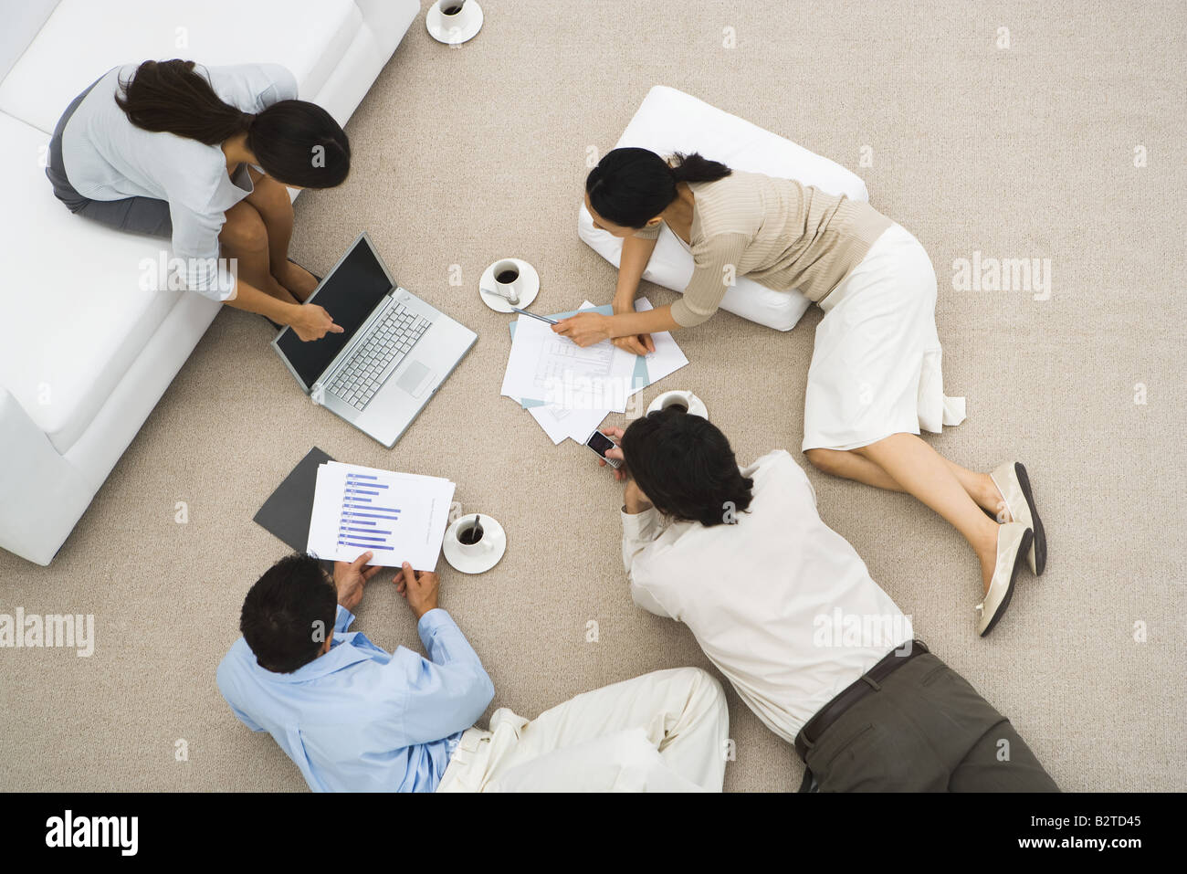 Business meeting, people reclining on the floor, high angle view Stock ...