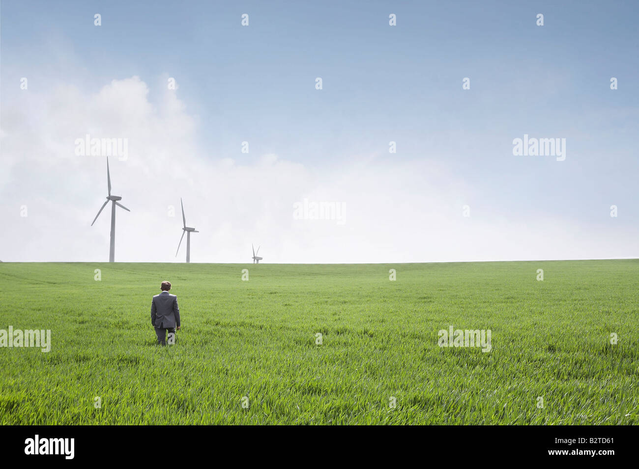 Man walking towards wind turbine hi-res stock photography and images ...