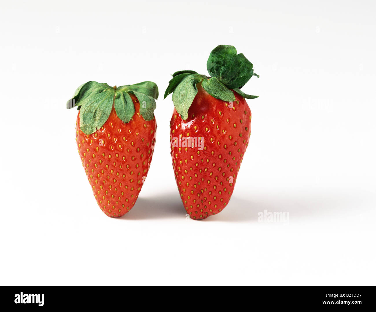 Two strawberries, close-up Stock Photo - Alamy