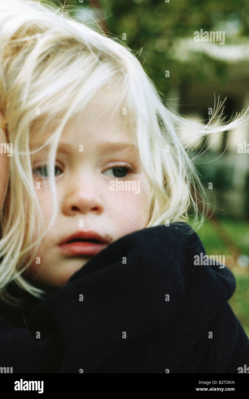 Little girl looking away, frowning, portrait Stock Photo - Alamy