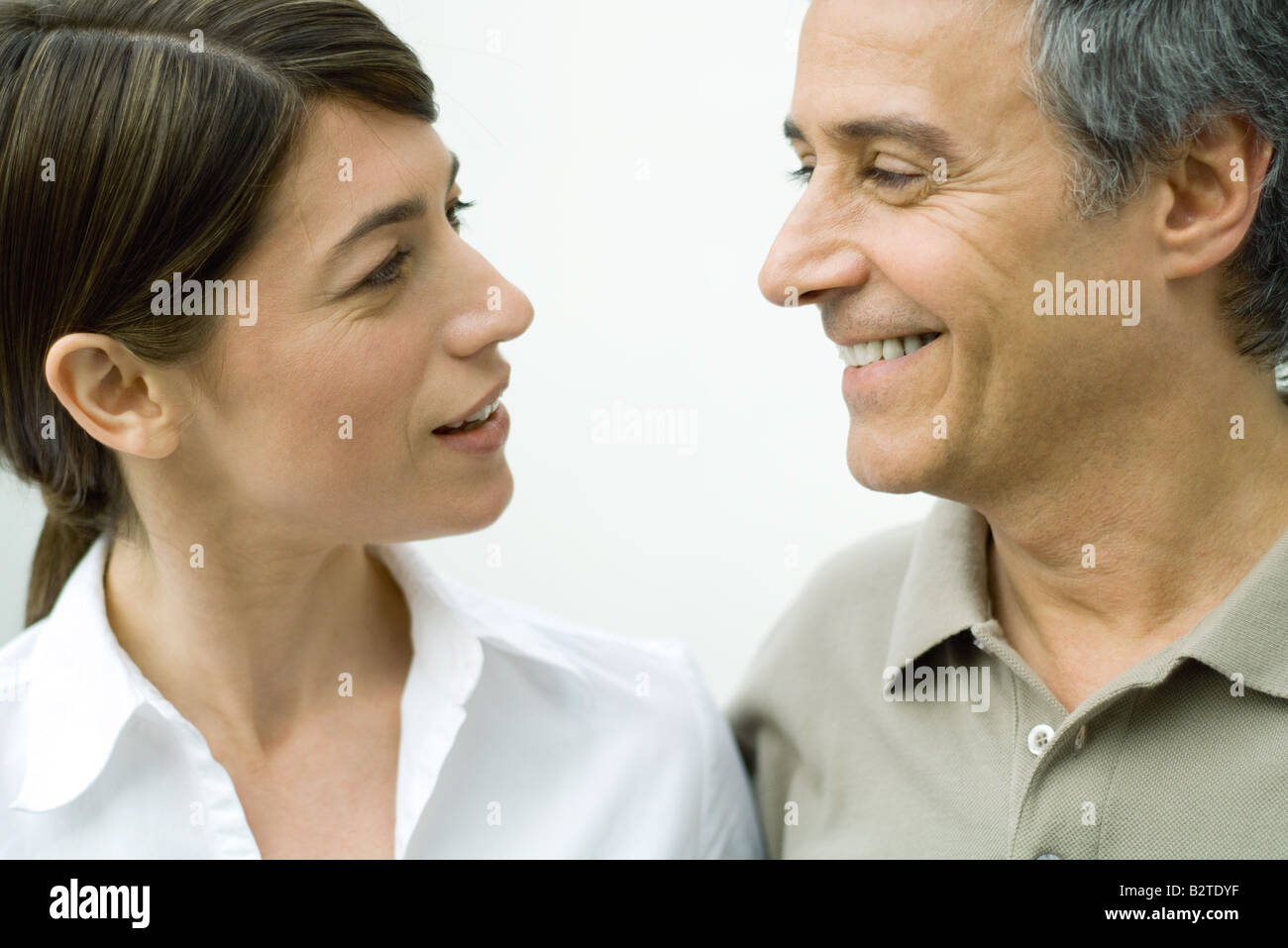 Couple smiling at each other, close-up Stock Photo - Alamy
