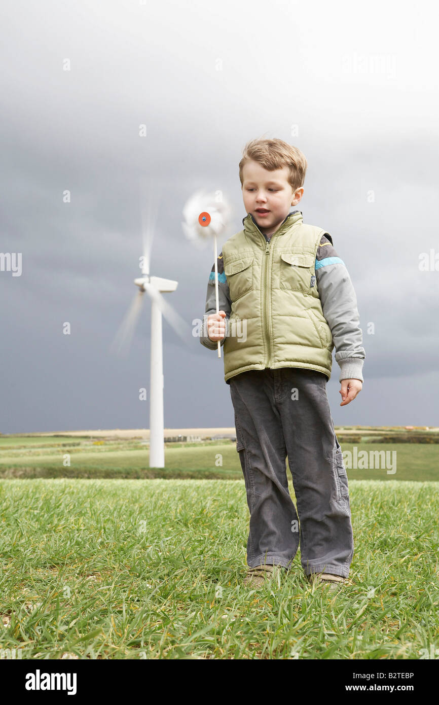Boy with windmill on a wind farm Stock Photo - Alamy