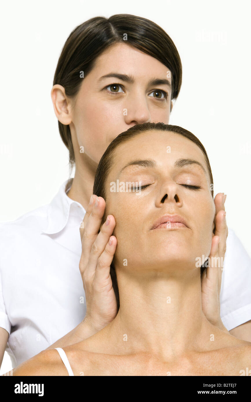 Woman receiving head massage, eyes closed Stock Photo - Alamy